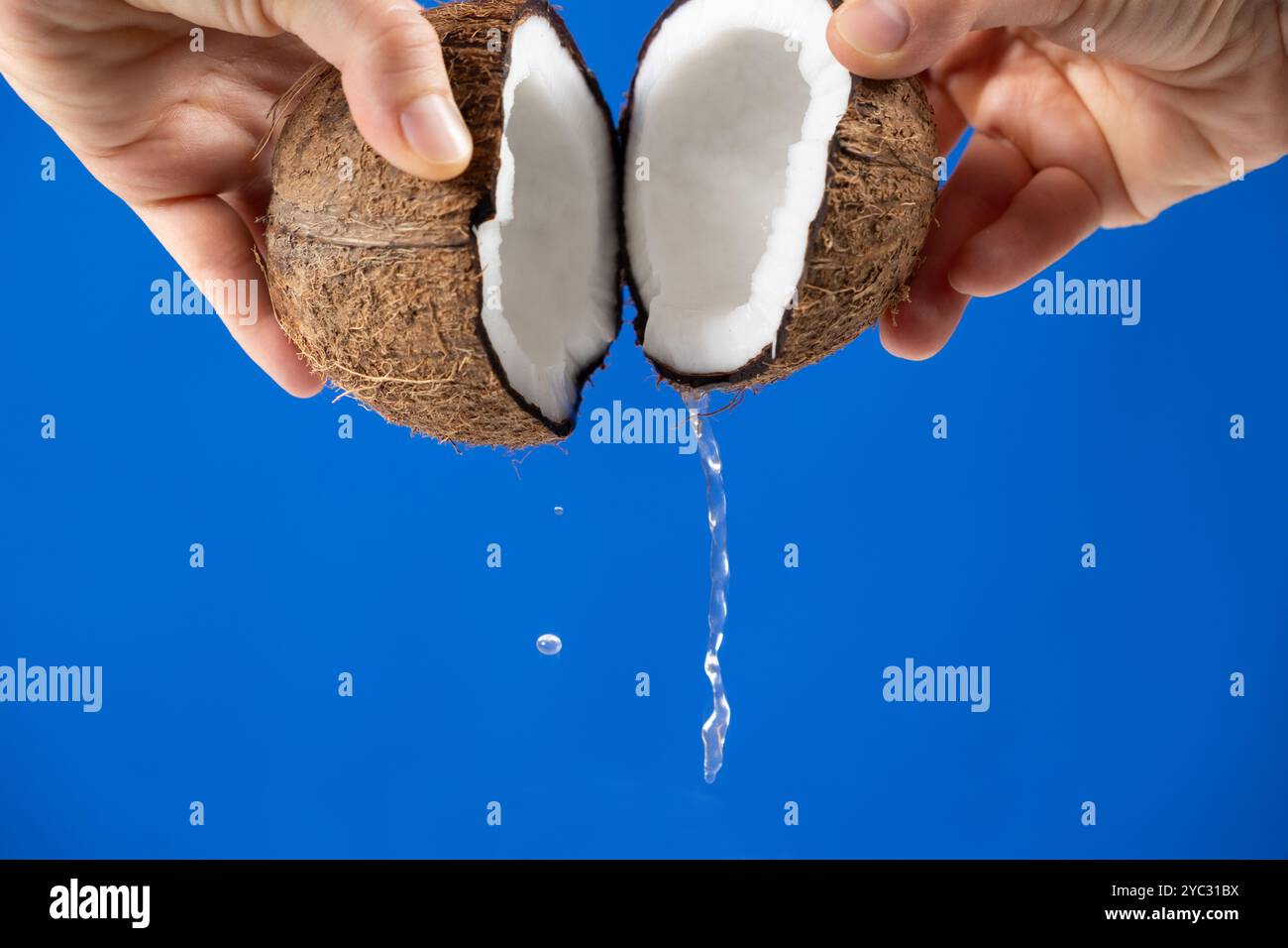 Cracked coconut splashing water hi-res stock photography and images - Alamy