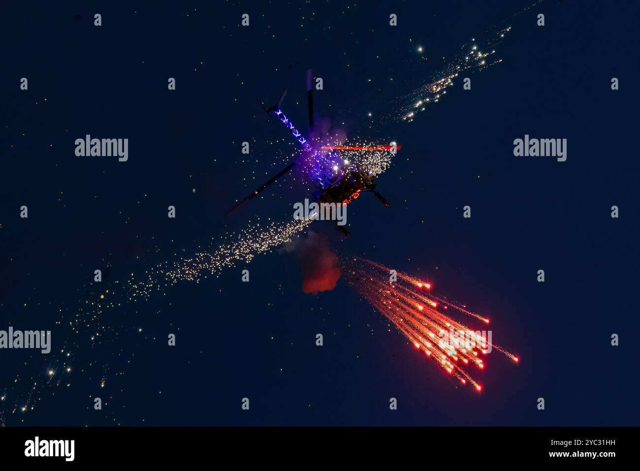 Helicopter Otto dusk display with fireworks Stock Photo - Alamy