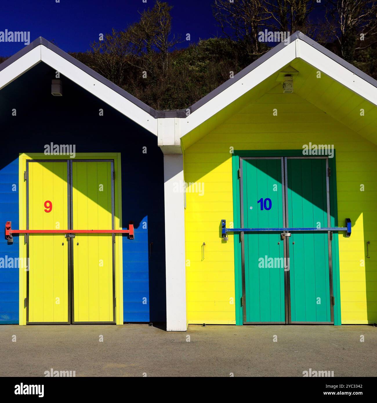 Colourful painted wooden beach huts - number 9 and number 10 - Barry ...