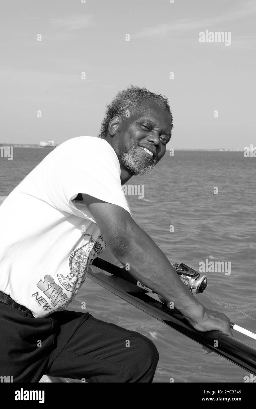 African american man smiling while fishing hi-res stock photography and ...