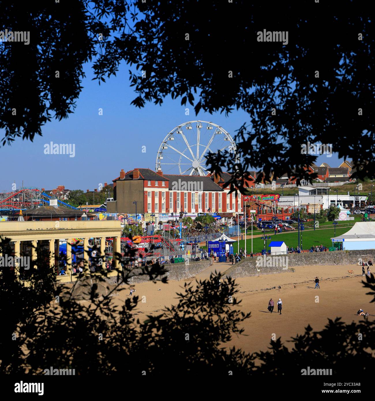 View through trees of Barry Island seaside resort and beach, Cardiff ...
