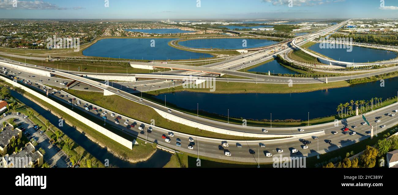 Aerial view of american highway junction with fast driving vehicles in ...