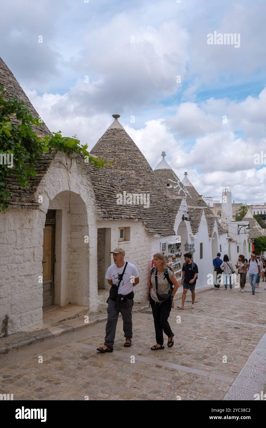 Alberobello Italy 18 September 2024 Visitors stroll through the narrow streets of Alberobello ...