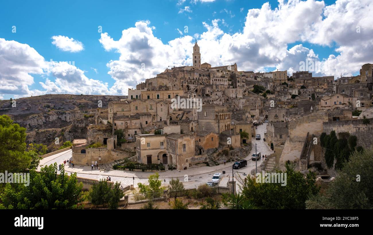 In Matera Italy, visitors explore historic stone buildings and stunning ...