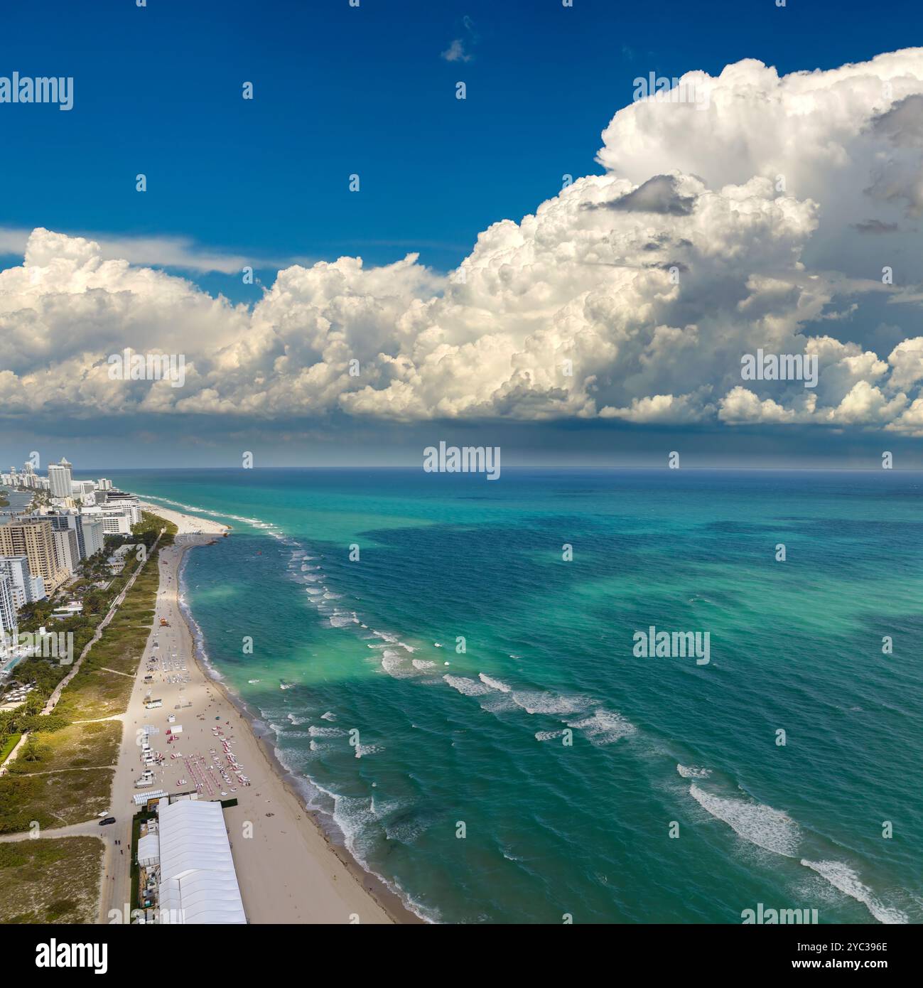 Aerial view of South Beach sandy surface with tourists relaxing on hot ...