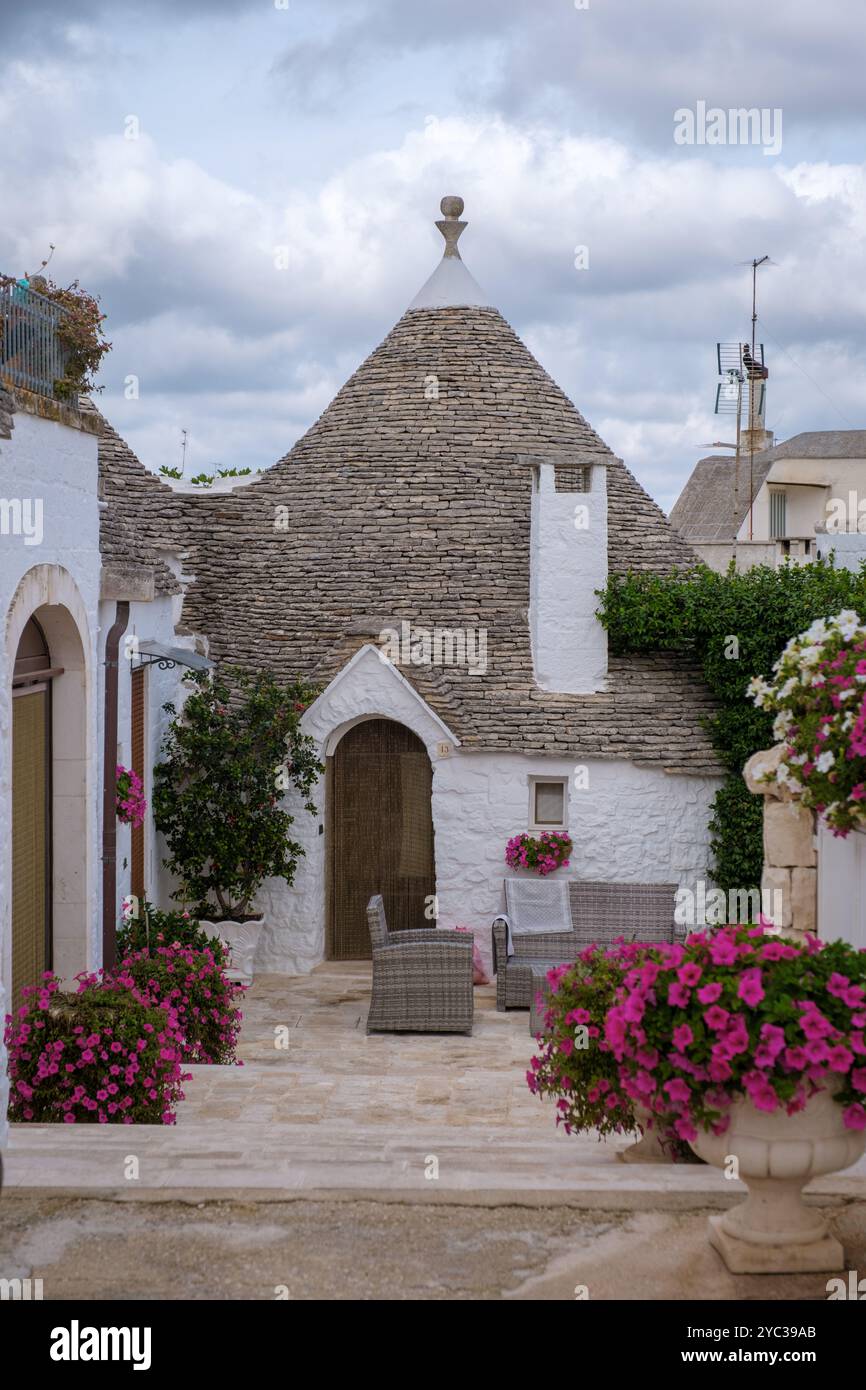 Alberobello Wander through a quaint courtyard in Puglia, where ...