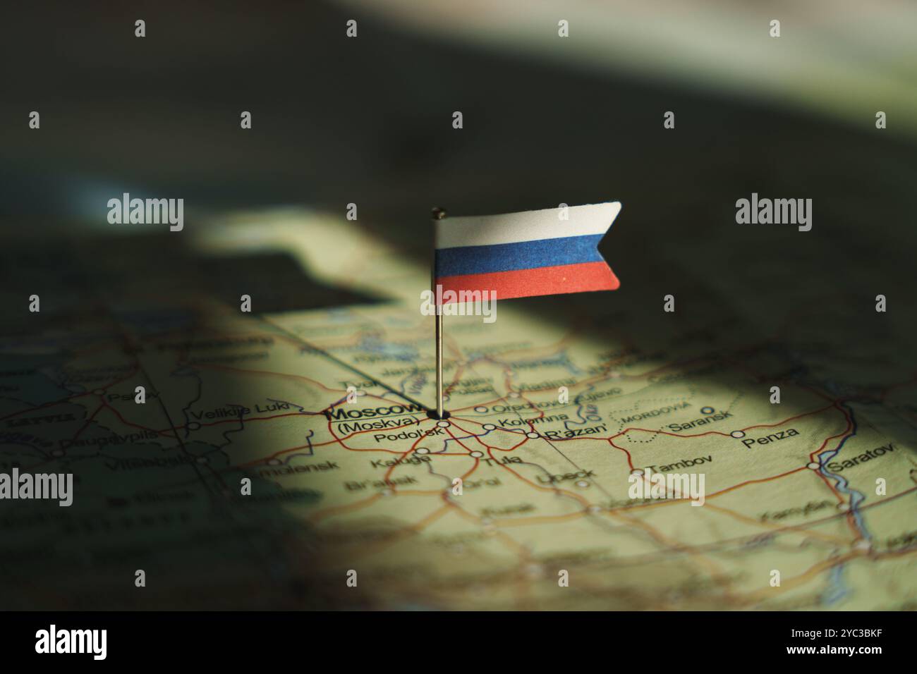 Russian federation flag on Russia map highlighted by dramatic light ...