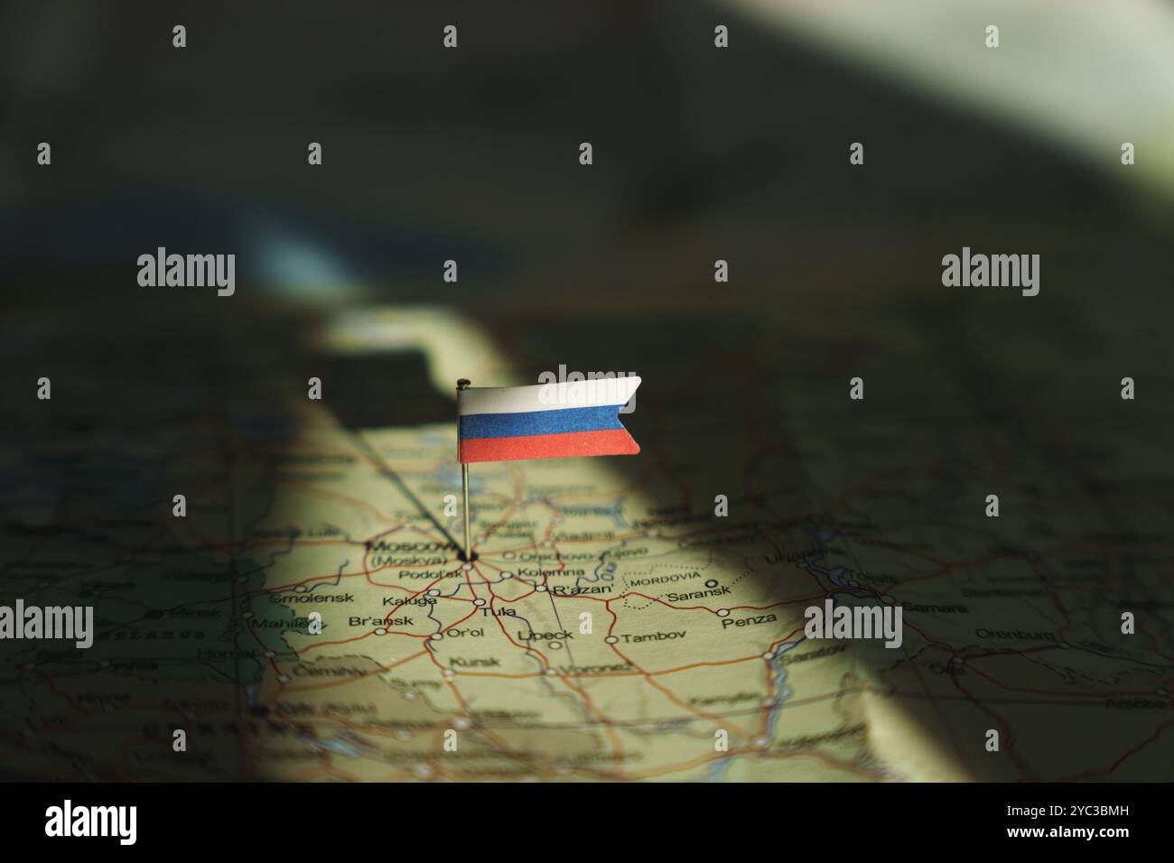 Russian federation flag on Russia map highlighted by dramatic light ...