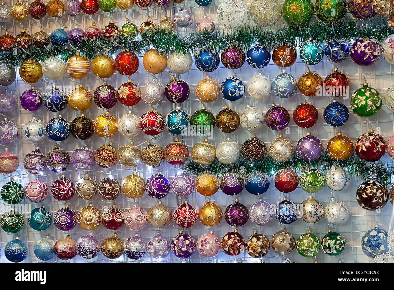 Multi-colored Christmas balls on a store counter. Christmas decorations ...