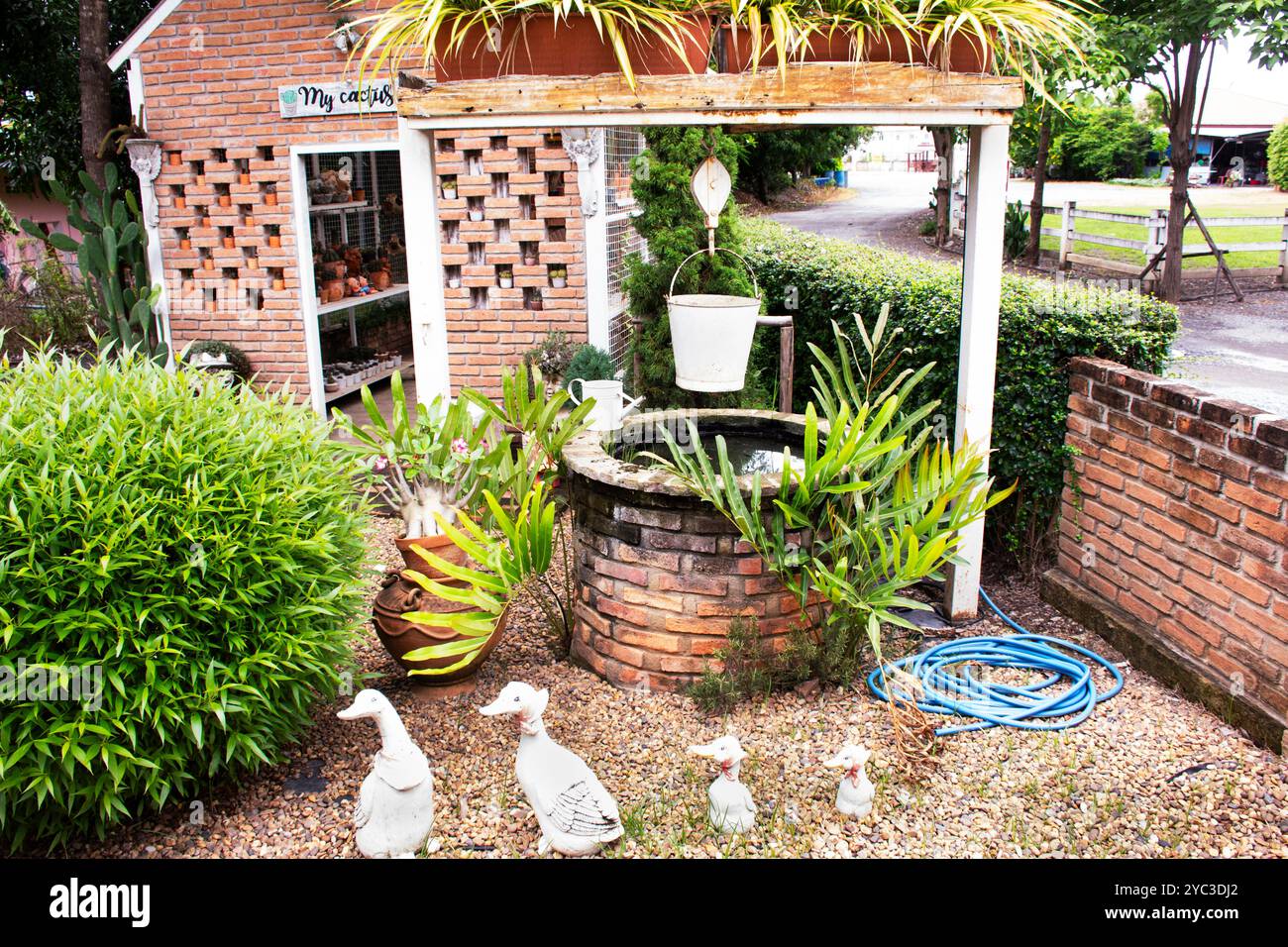 Classic vintage retro antique stone brick artesian water well and roof ...