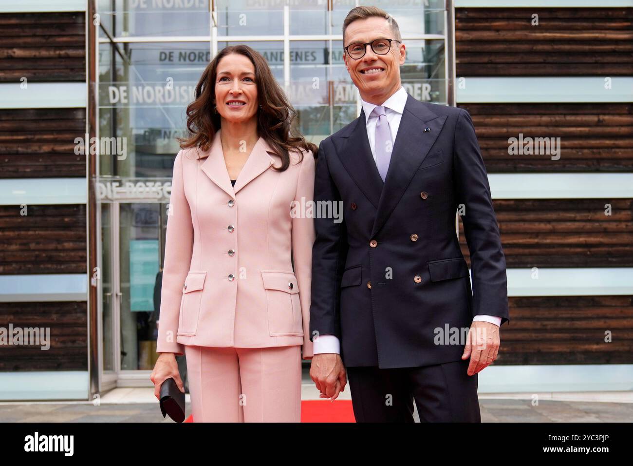 Finland's president Alexander Stubb and his wife Suzanne Innes-Stubb arrive for a ceremony to ...