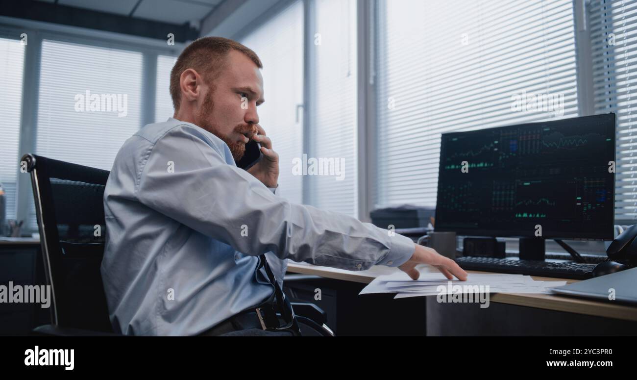 Business analyst studying diagrams in hi-res stock photography and ...