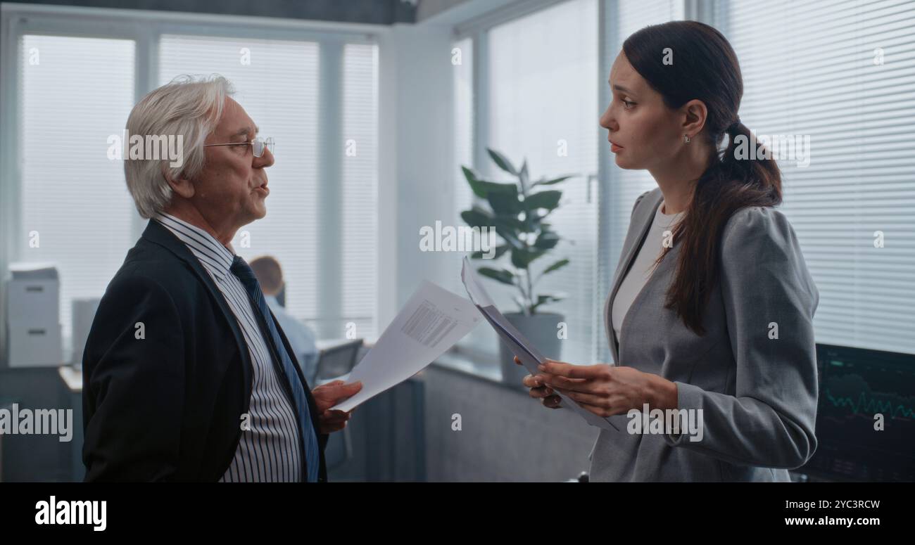 Male boss holding female employee hi-res stock photography and images ...
