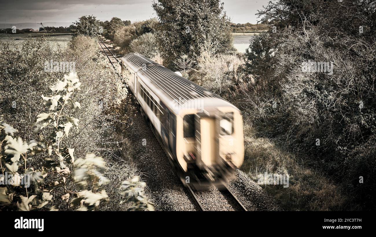 Single line railway route running through open country between ...