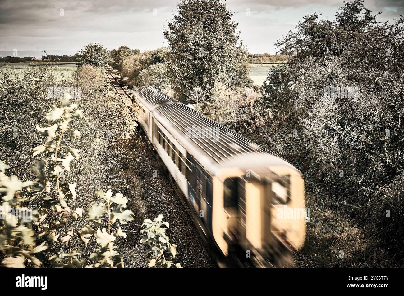 Single line railway route running through open country between ...