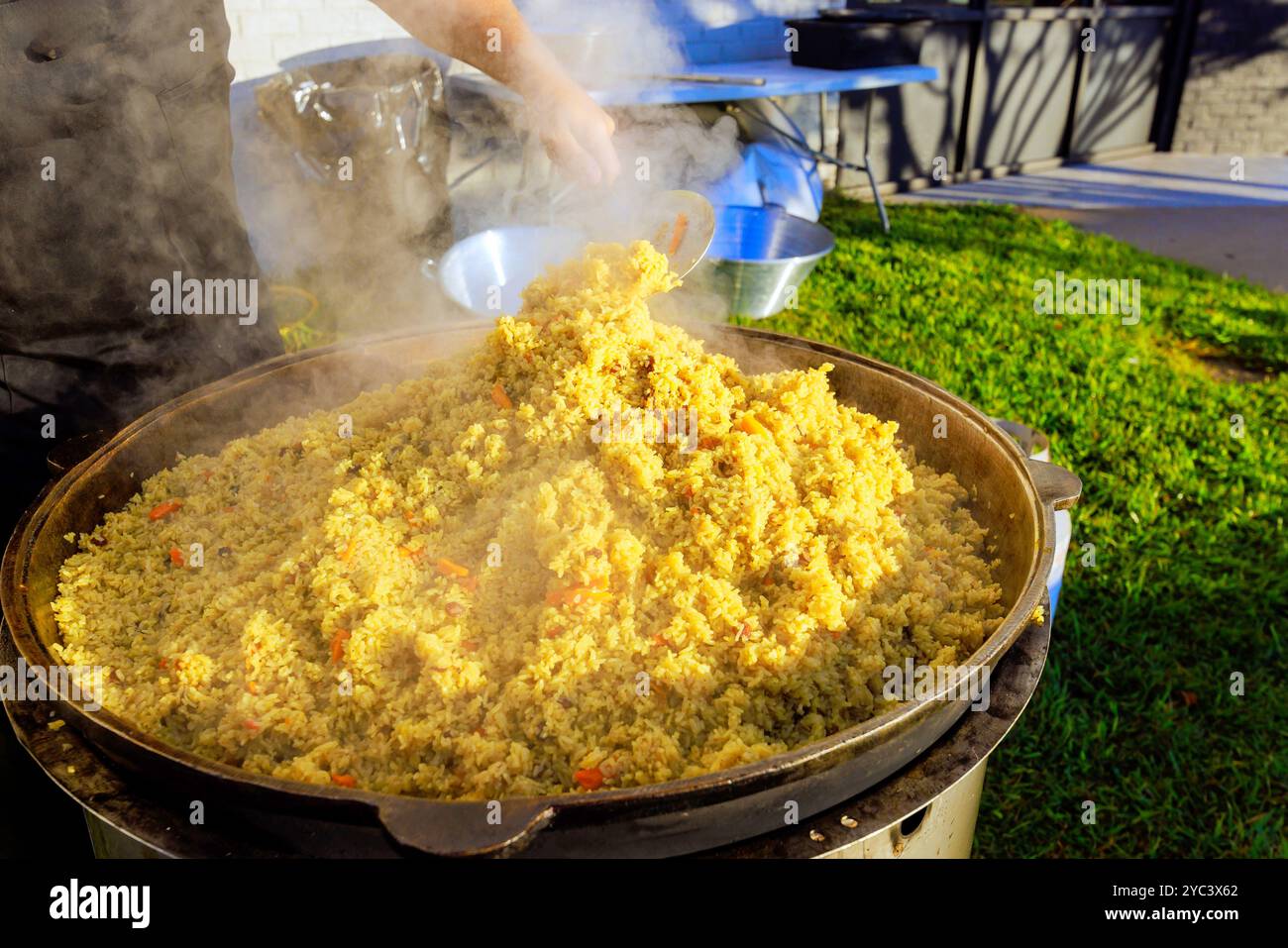 Large cast iron cauldron, during cooking cuisine traditional is Turkish ...
