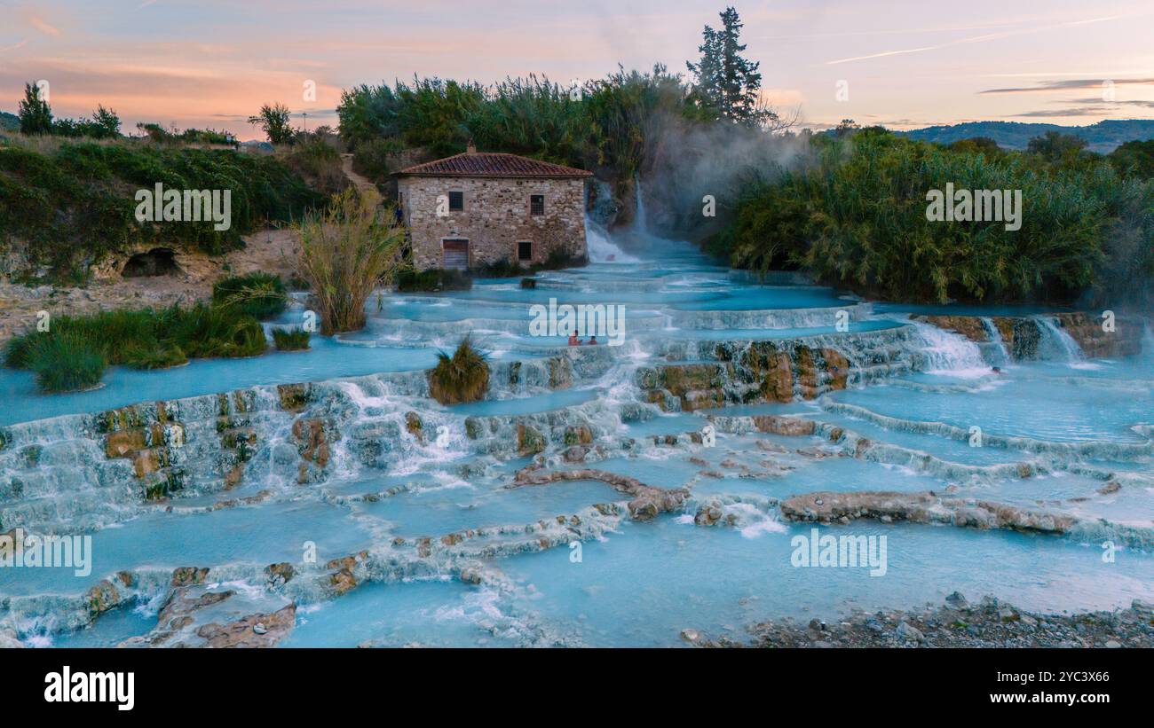 Visitors unwind in the stunning, natural thermal pools of Saturnia, as ...