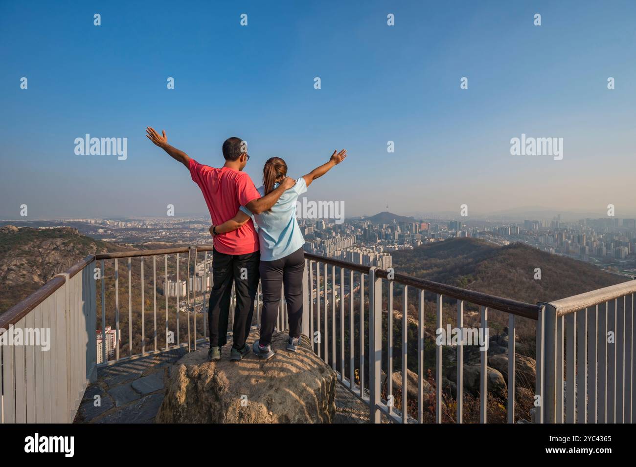 Seoul South Korea city skyline view from Ansan mountain peak with lover ...