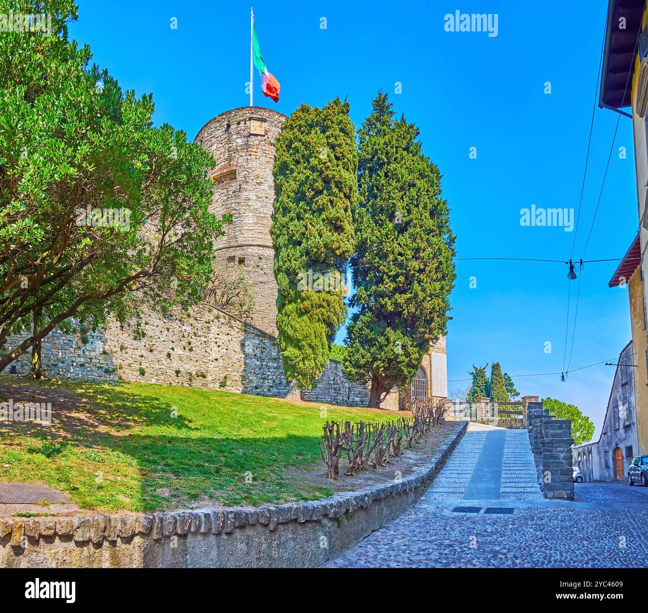 The medieval Rocca di Bergamo fortress is surrounded with lush green ...