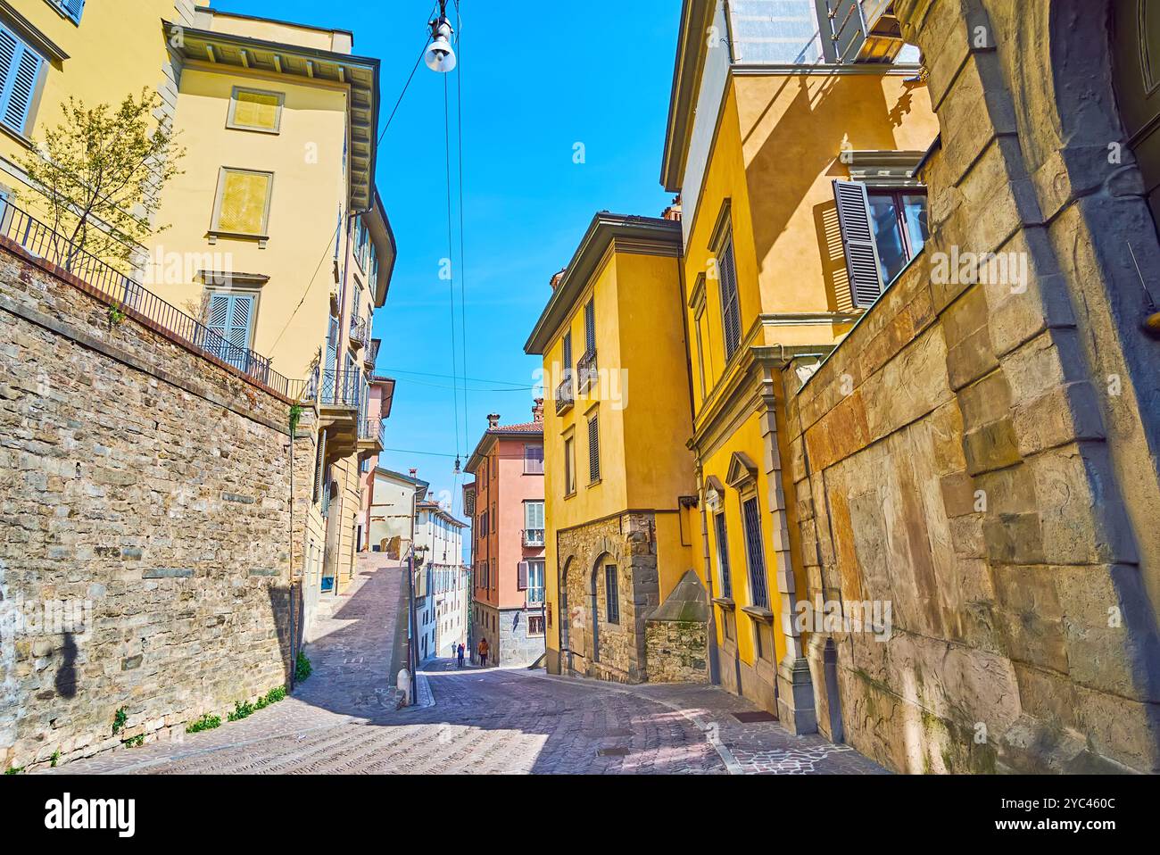 The medieval stone houses along historic Via Porta Dipinta street in ...