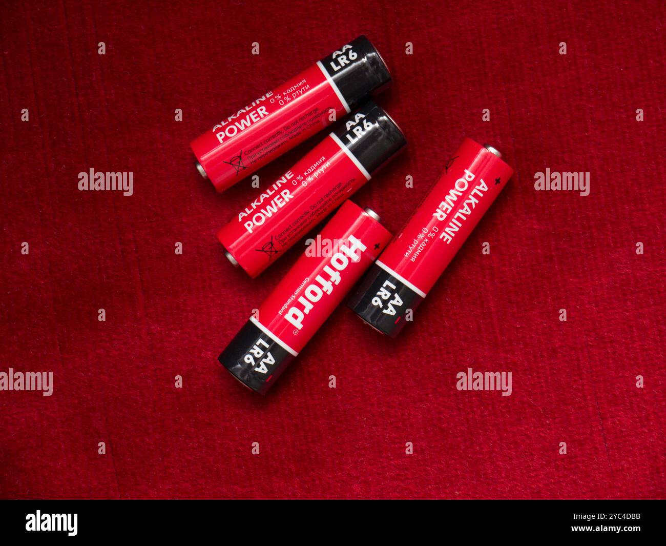 Hofford AA Eneloop alkaline battery on a red background Stock Photo - Alamy