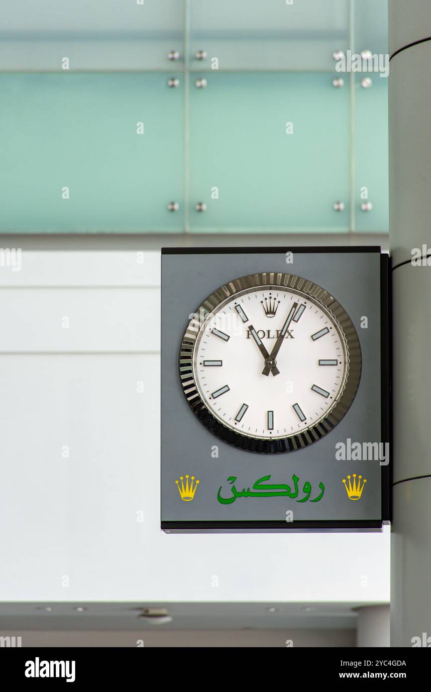 Wall-mounted Rolex clock with Arabic text in Dubai International ...