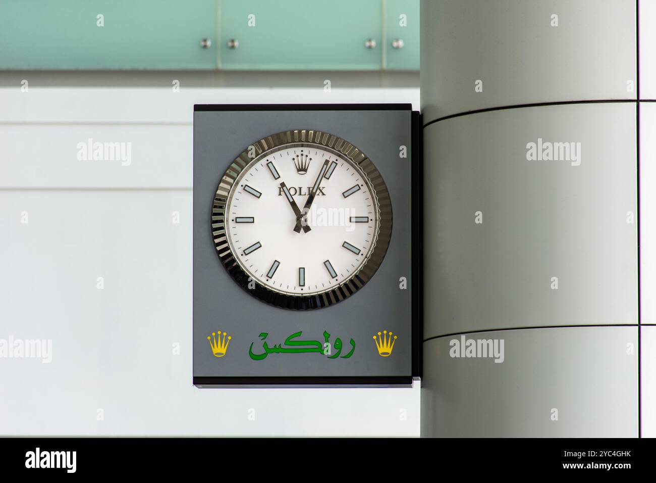Wall-mounted Rolex clock with Arabic text in Dubai International ...