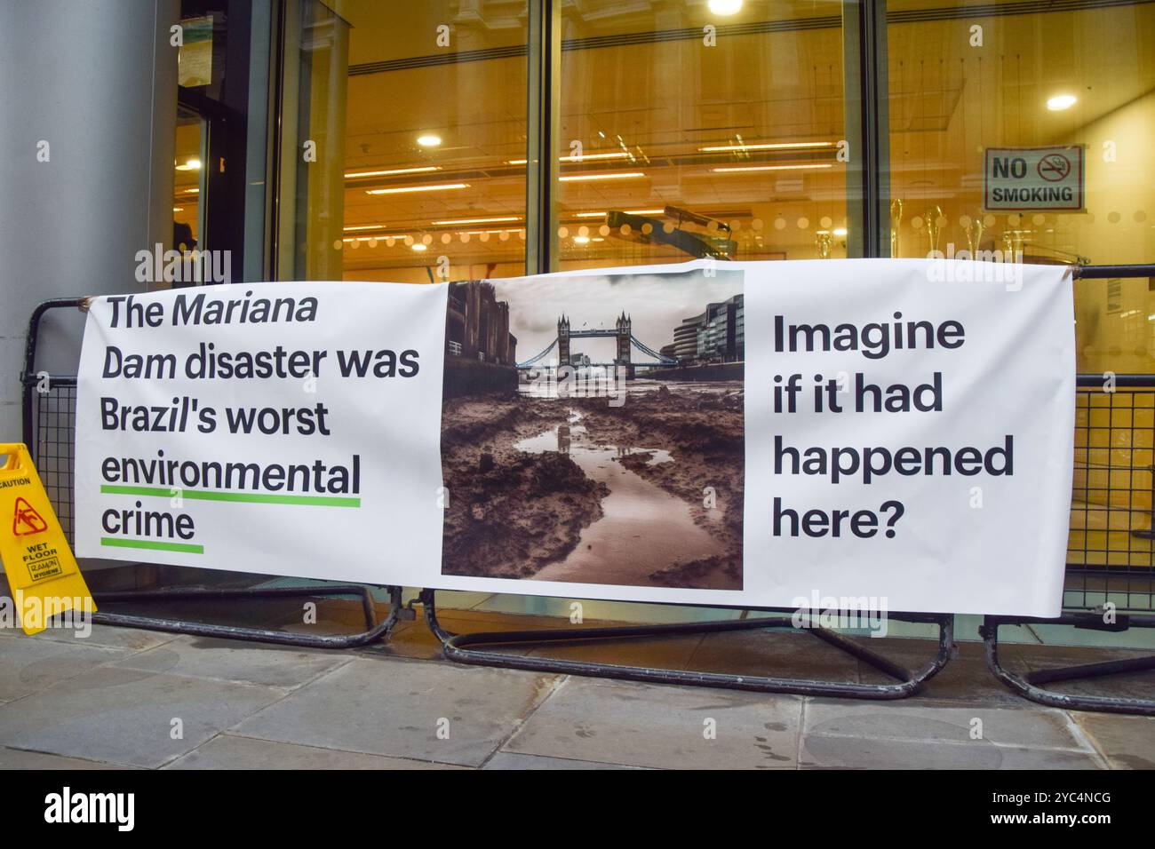 London, UK. 21st Oct, 2024. A banner about the Mariana Dam disaster ...