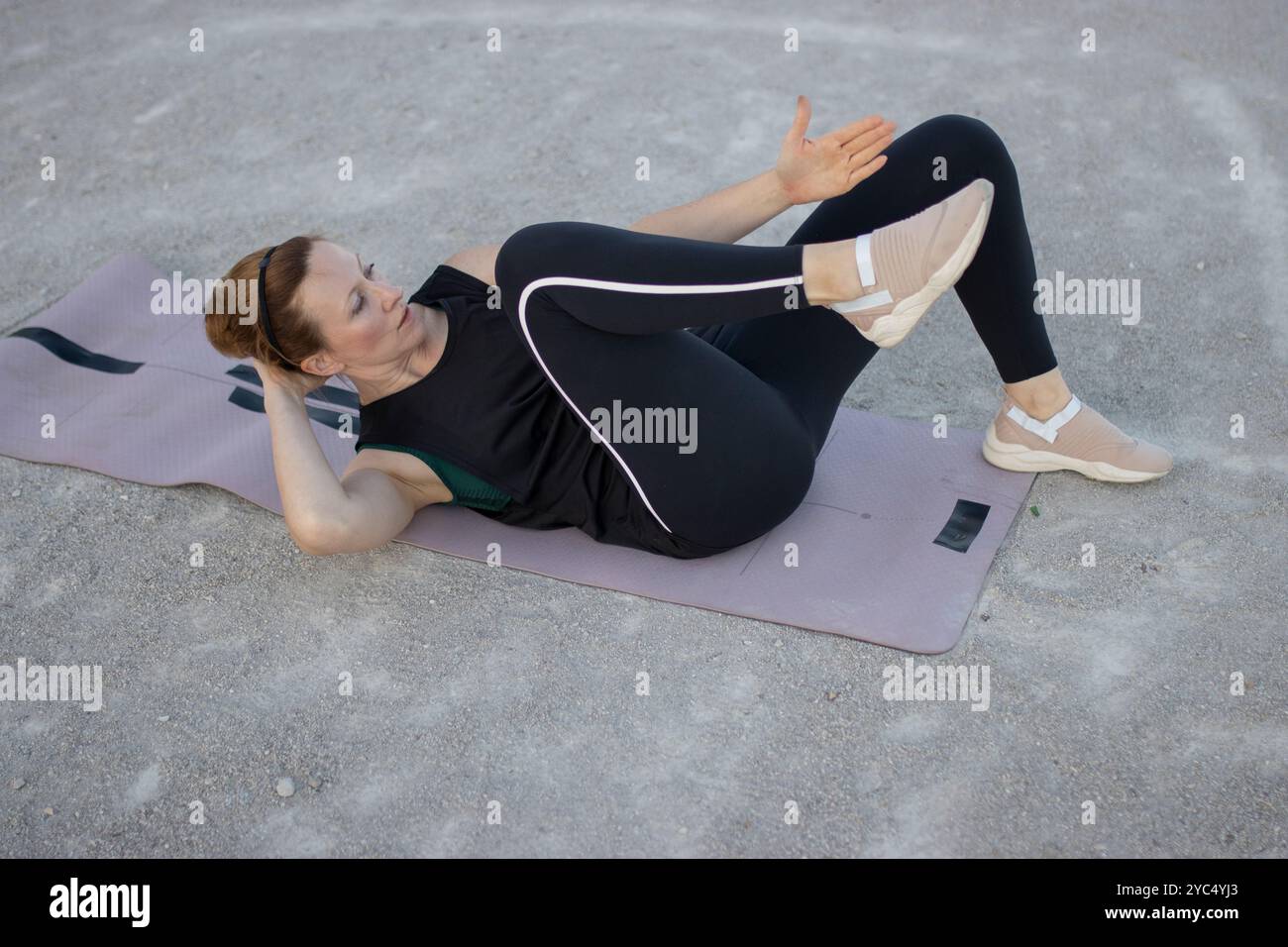 Athletic woman doing crunch exercises for abdominal muscles outdoor ...