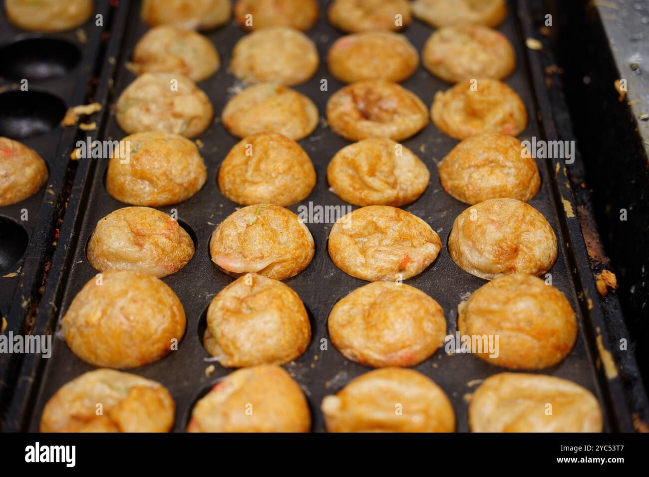 Takoyaki is a Japanese dish made by putting octopus in a flour batter ...