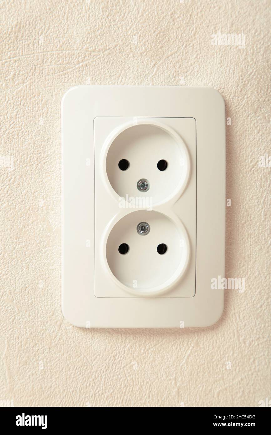 White double socket on wall - electric plug. Top view Stock Photo - Alamy