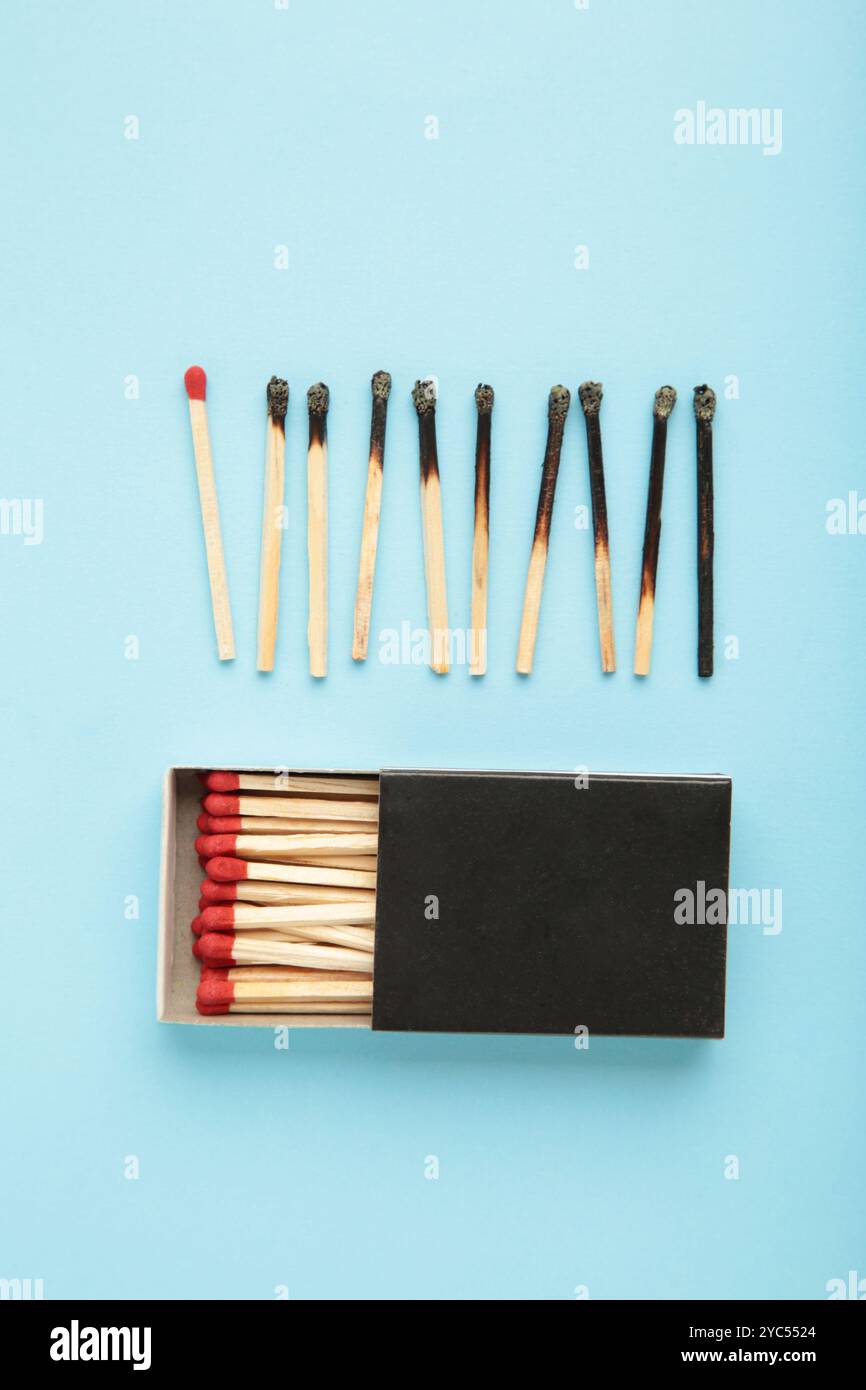 Burnt matches on blue. Different stages of match burning Burnt matches ...
