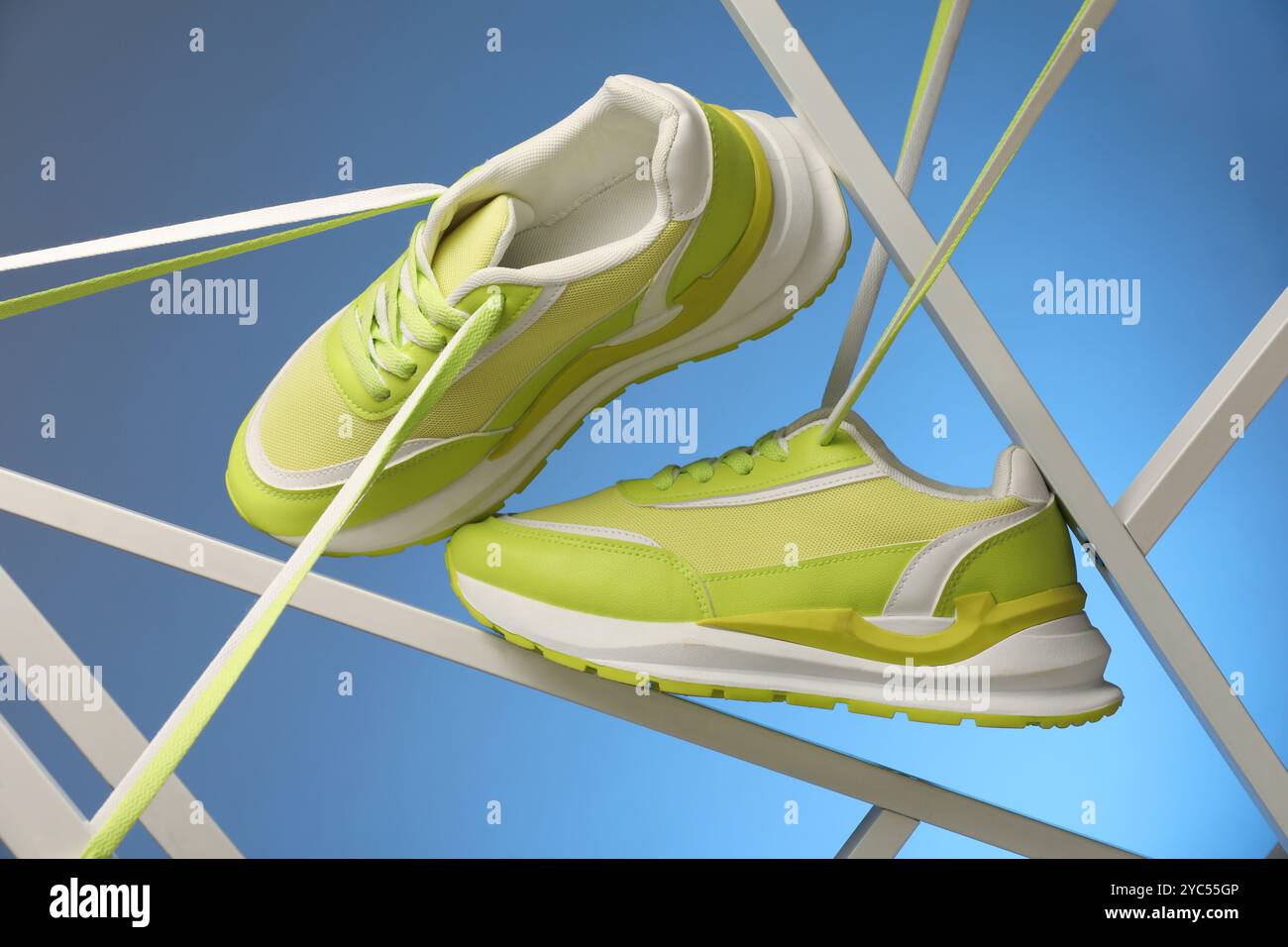 Stylish presentation of sneakers against light blue background Stock ...