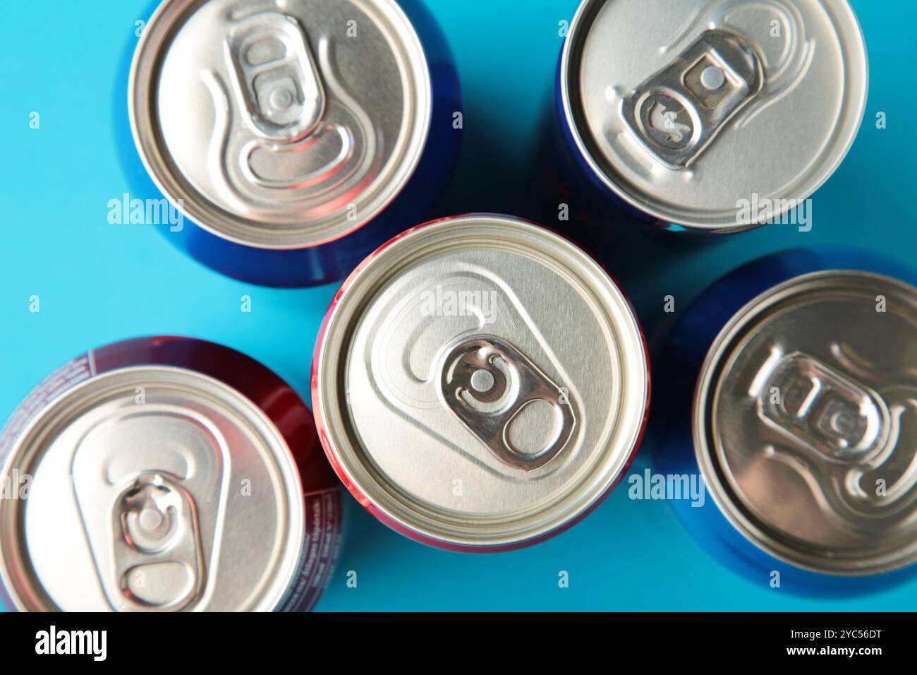 Aluminum drink or beverage cans with pull ring on blue background. Top ...
