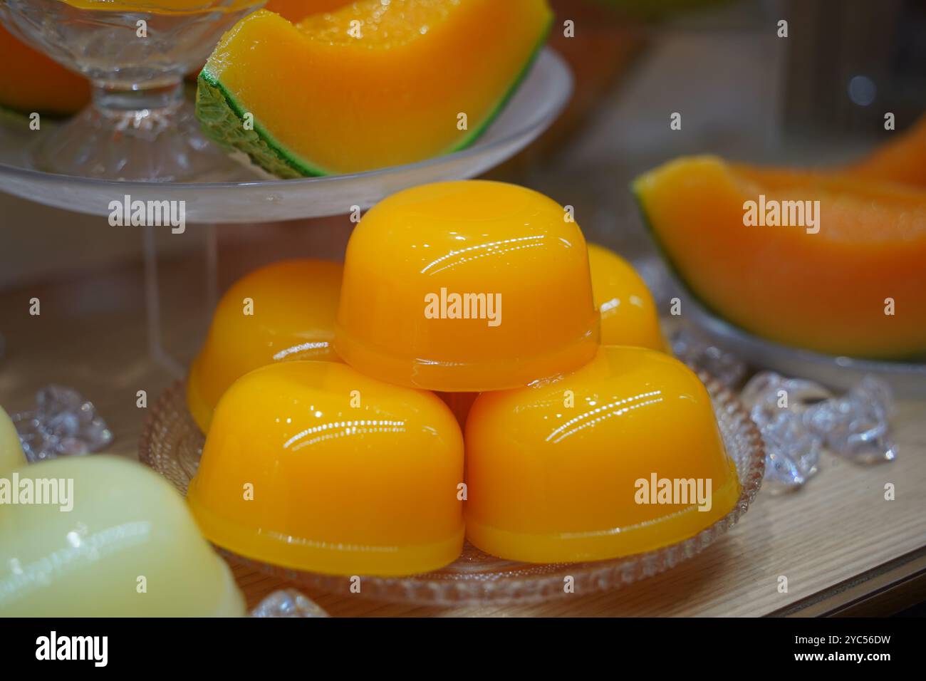 Mango pudding with melon on display in a shop window Stock Photo - Alamy