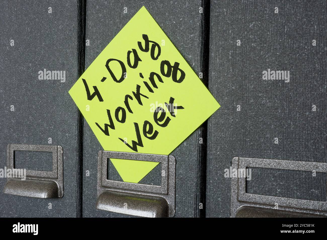 Sticky note with the phrase four day working week. Work-life balance ...