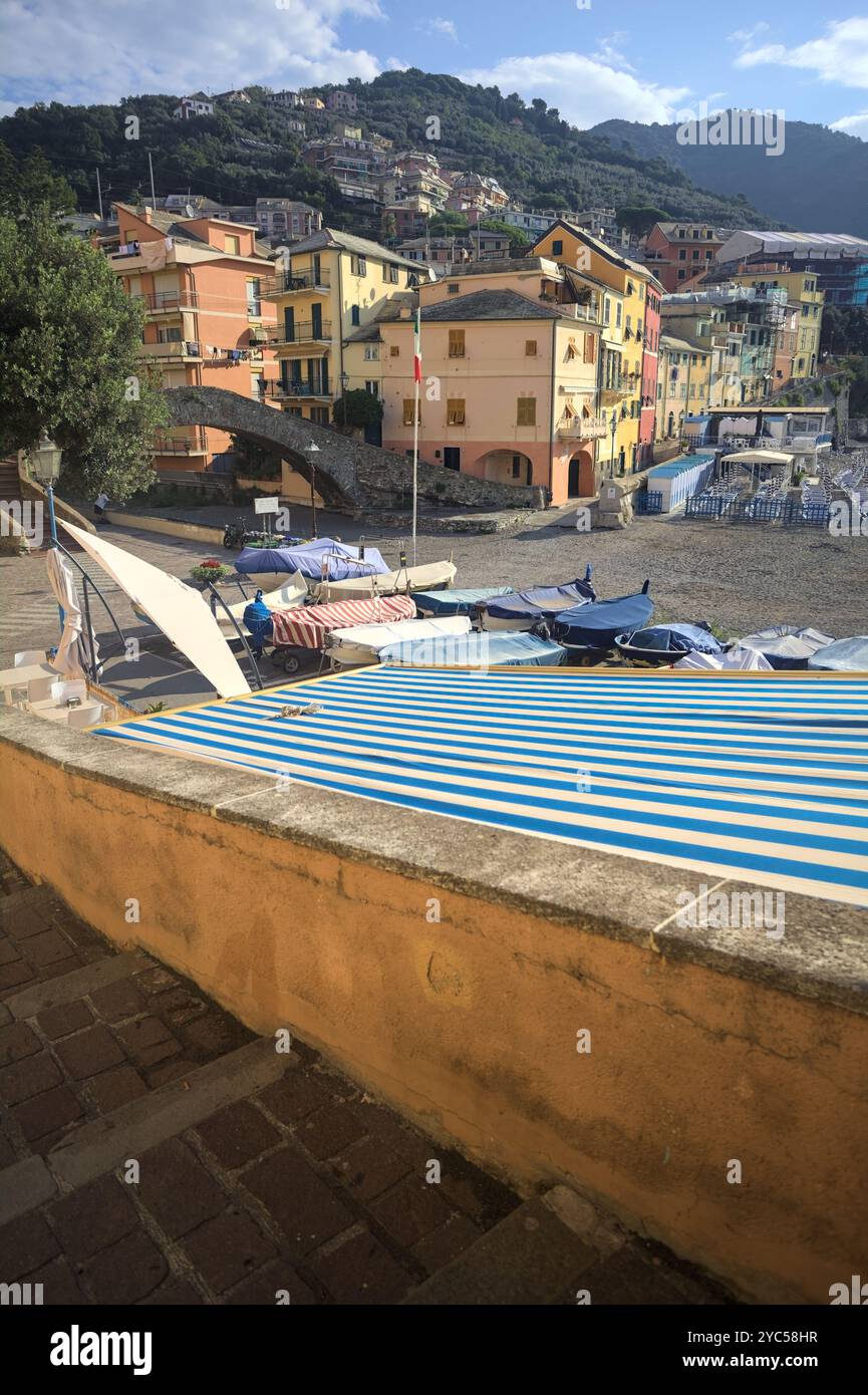 Bogliasco, Italy - September 2024 - Pebble beach and a stone bridge at ...