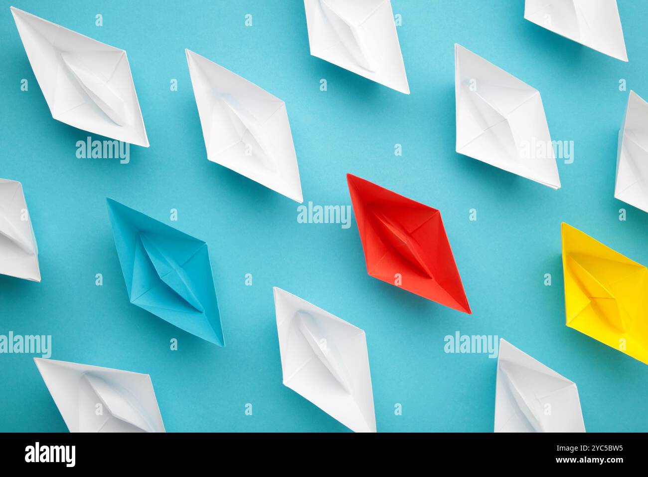 Colorful paper ships on blue background, Leadership and Business ...