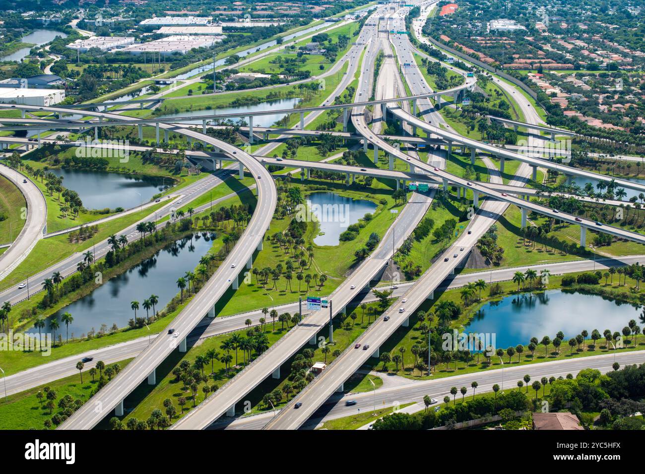 Aerial view of American freeway intersection with fast driving cars and ...
