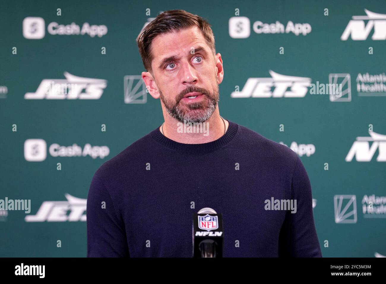 New York Jets quarterback Aaron Rodgers speaks to reporters following ...