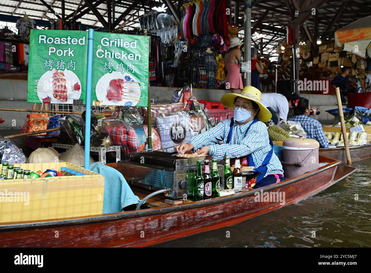 "Floating market Thailand" An old woman selling roasted pork and ...