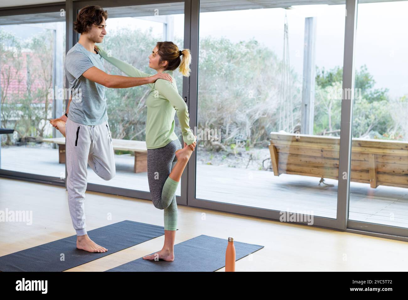 Yoga partners practicing meditation on hi-res stock photography and ...