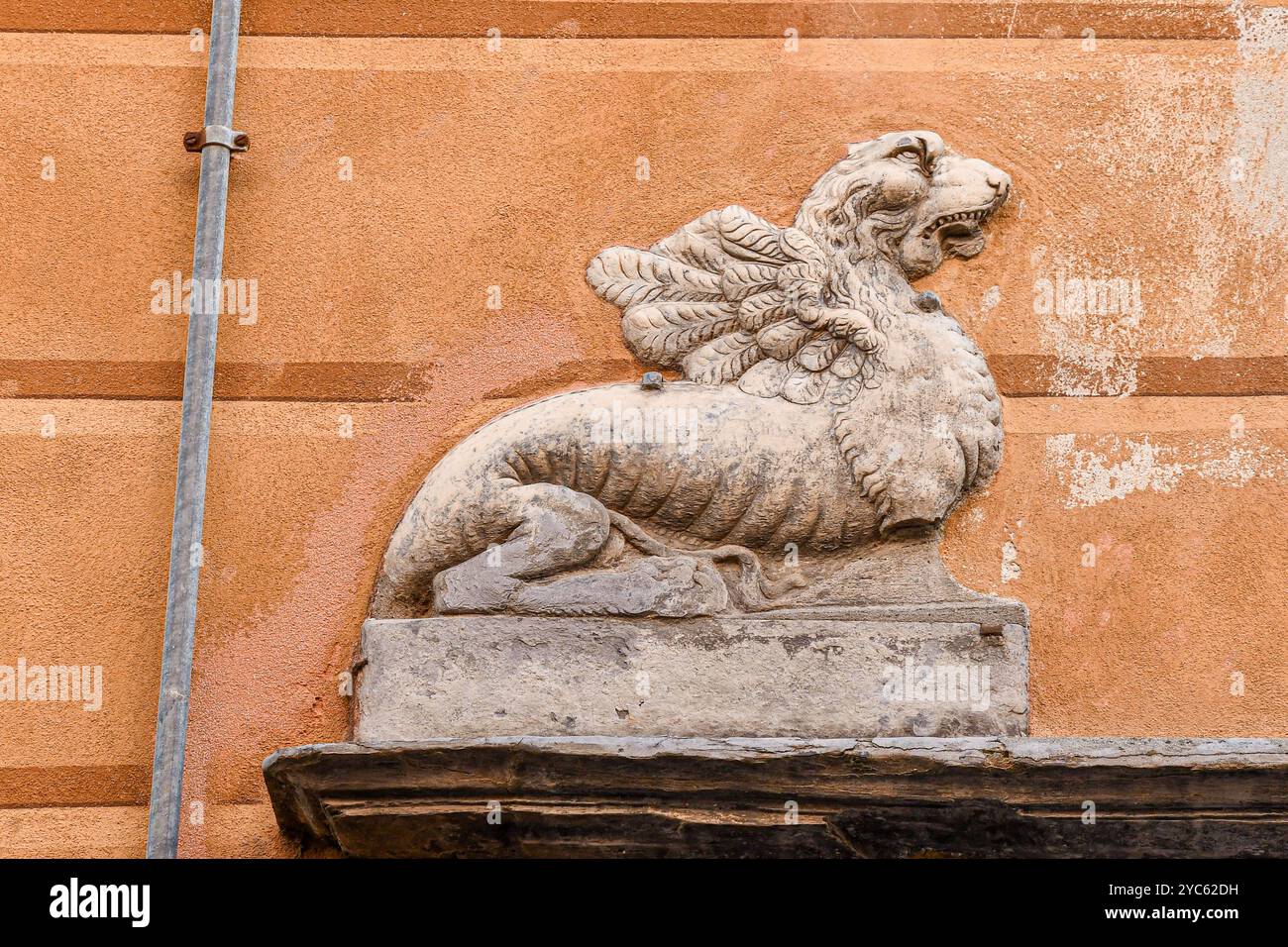 Detail of an over door in slate stone representing a winged lion or a ...