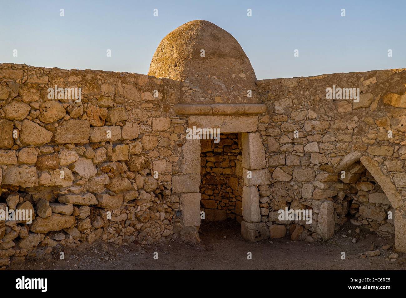 An ancient stone entrance featuring a domed structure above the doorway ...