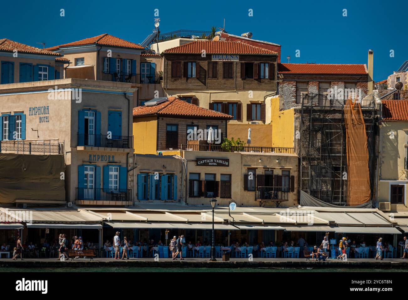 A vibrant view of traditional buildings along the waterfront of the Old ...
