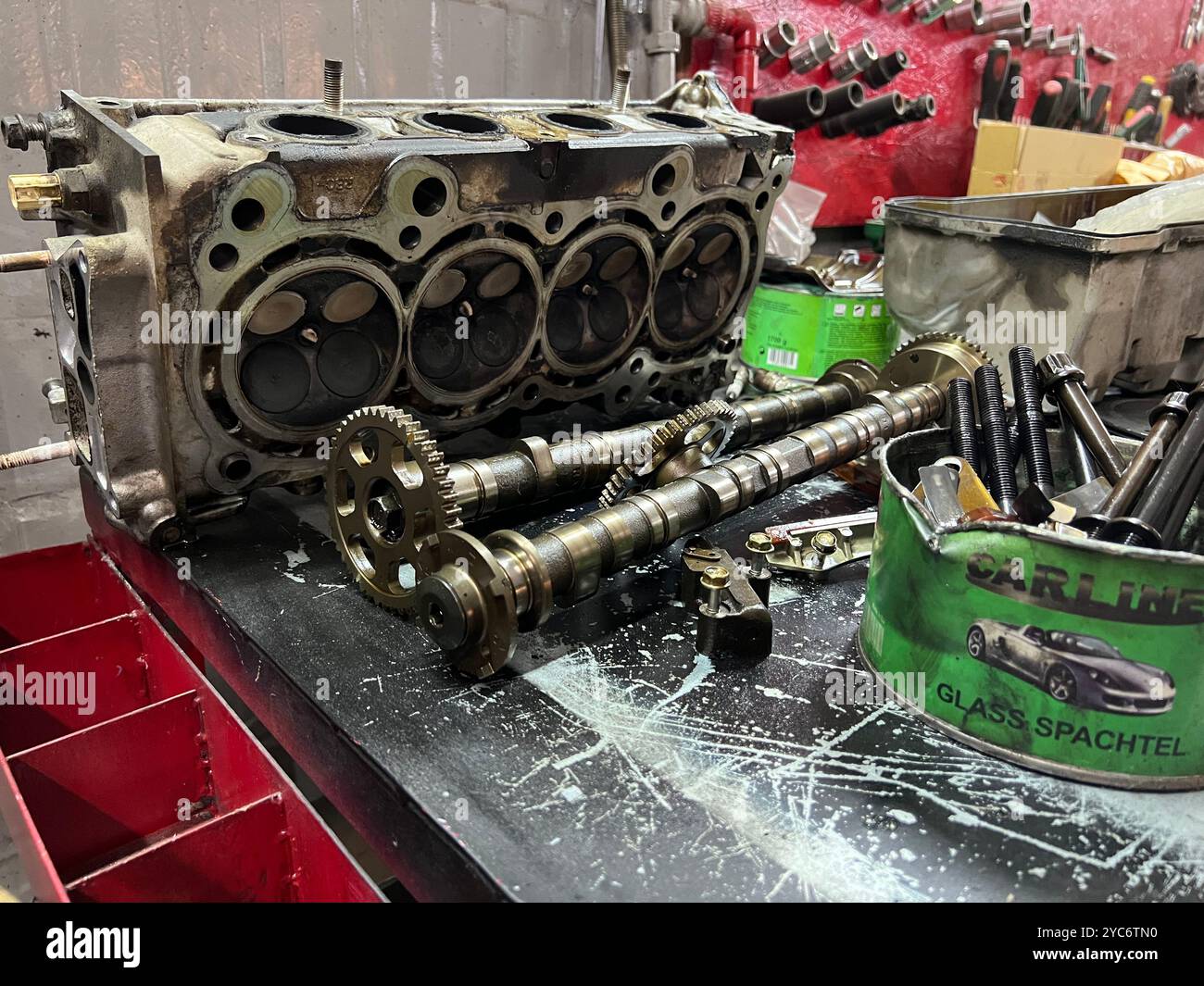 parts of an automotive manual transmission on a table in a car service ...