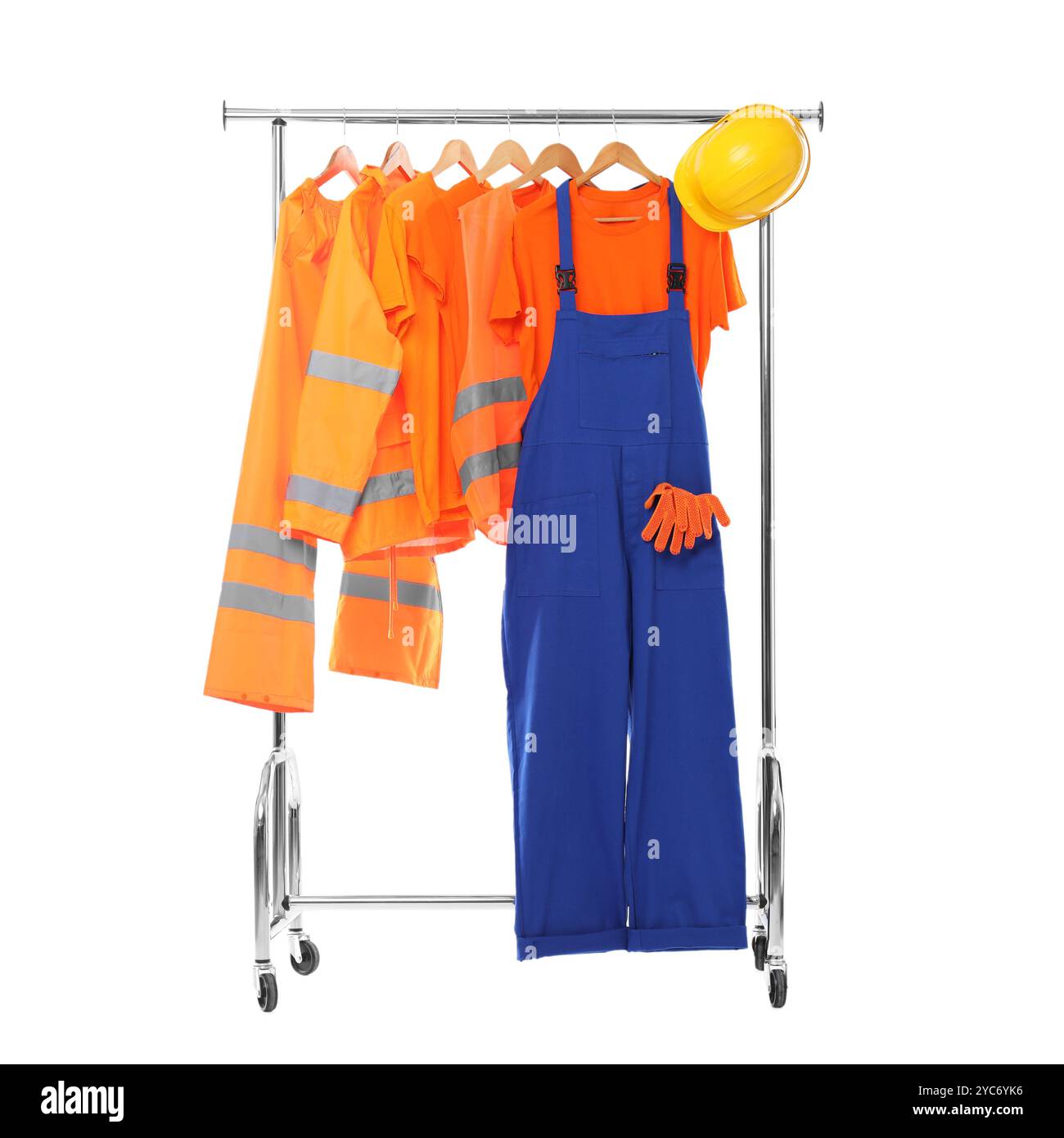 Workers' uniforms on clothing rack isolated on white Stock Photo - Alamy
