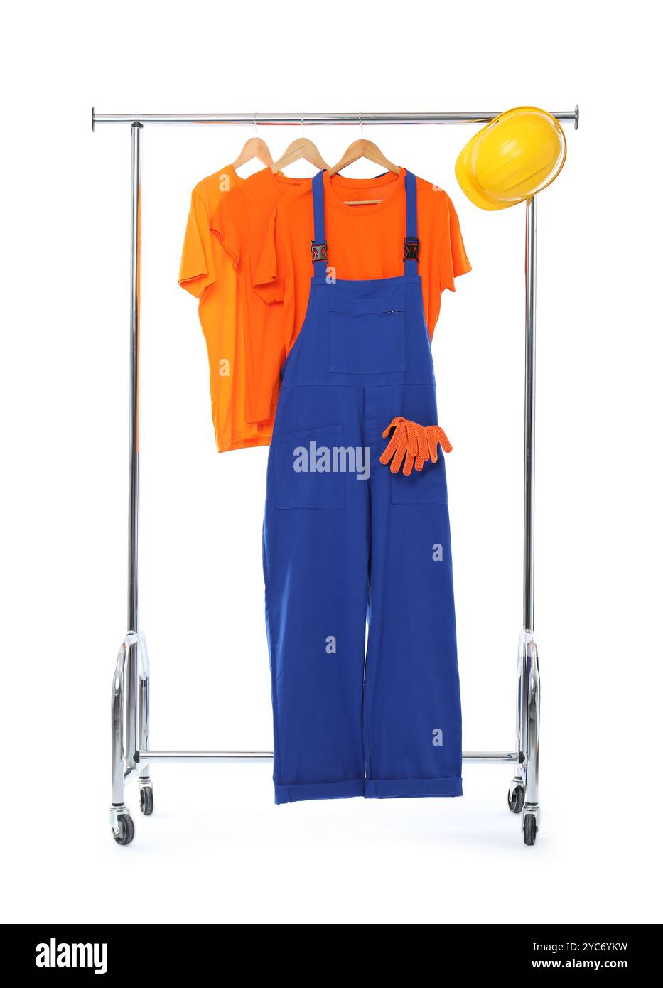 Worker's uniform and t-shirts on clothing rack isolated on white Stock ...