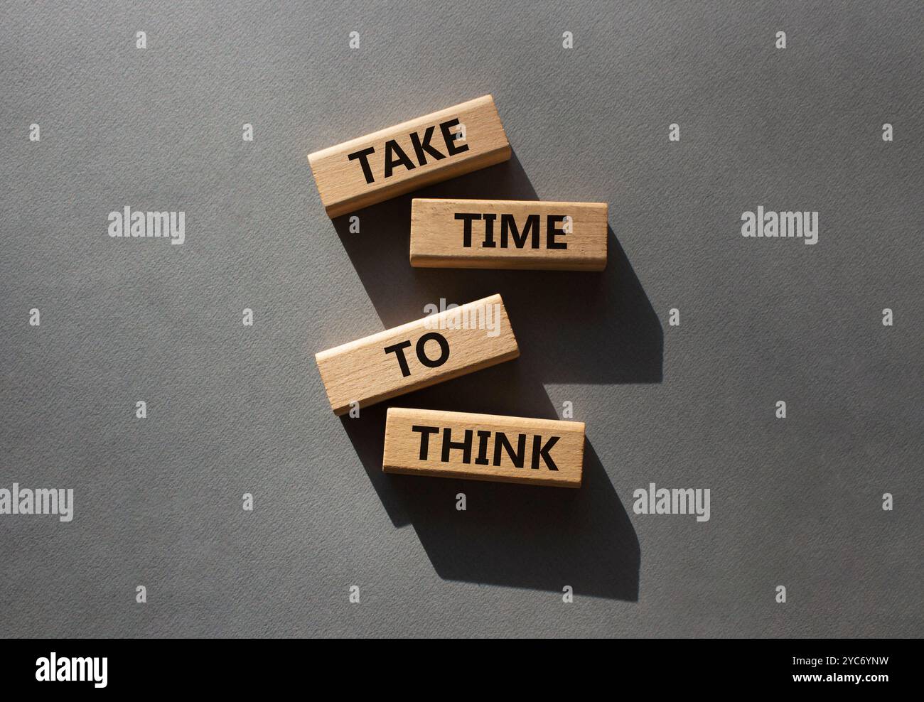 Take time to think symbol. Wooden blocks with words Take time to think ...