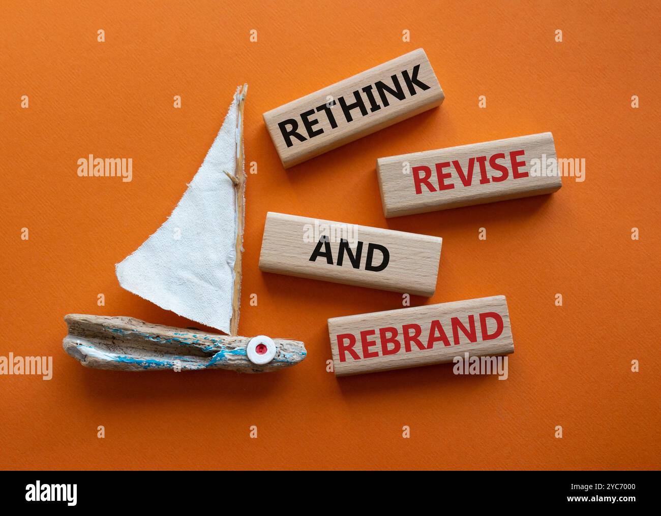 Rethink Revise and Rebrand symbol. Wooden blocks with words Rethink Revise and Rebrand ...